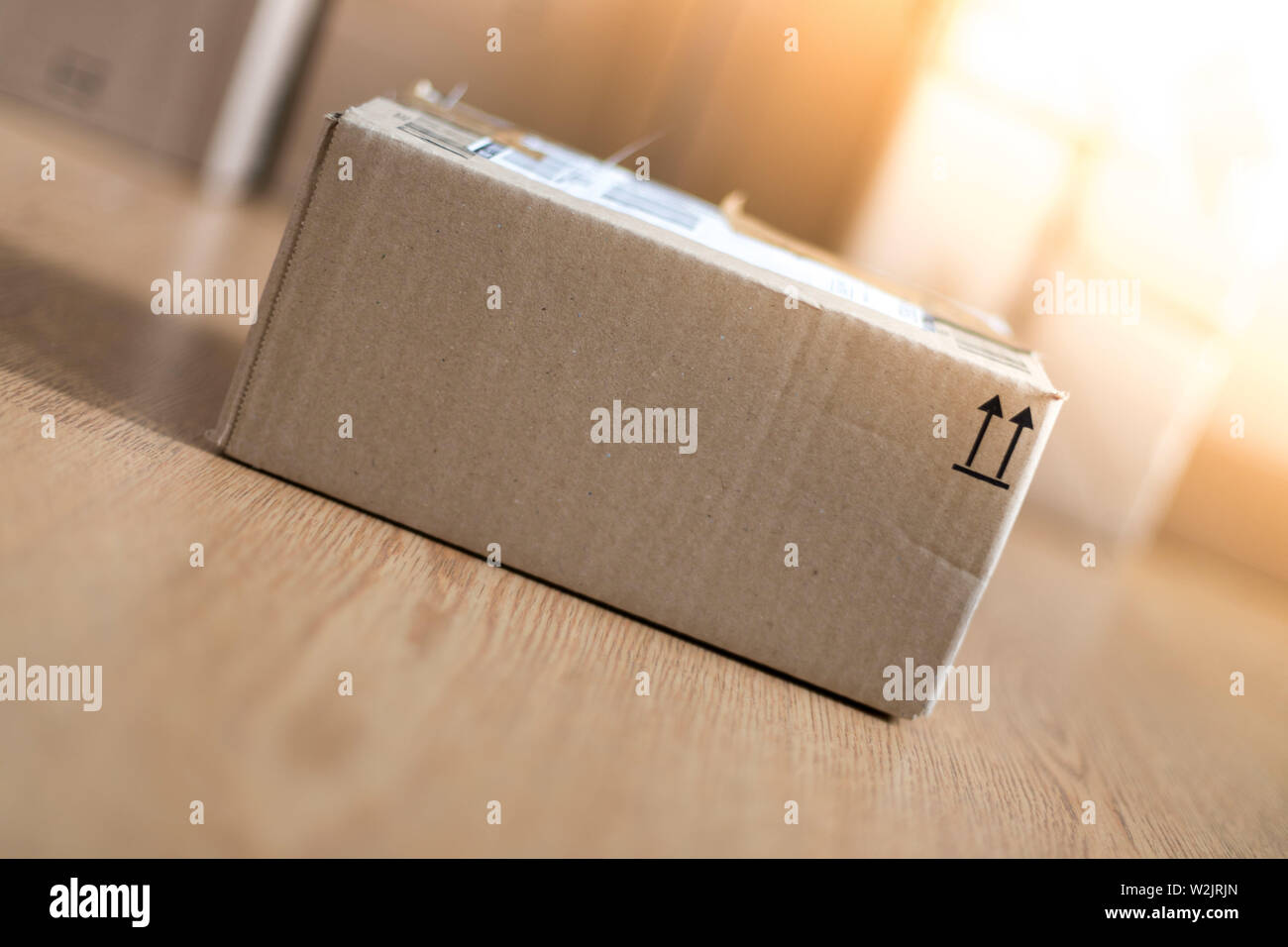 Cardboard box shipping concept: brown parcel Stock Photo - Alamy
