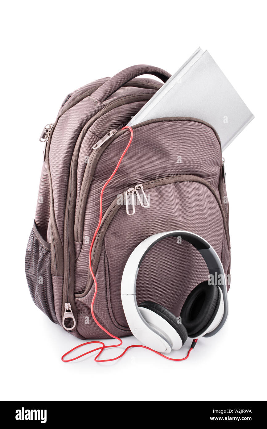 Backpack with headphones and notebook, isolated on white background ...