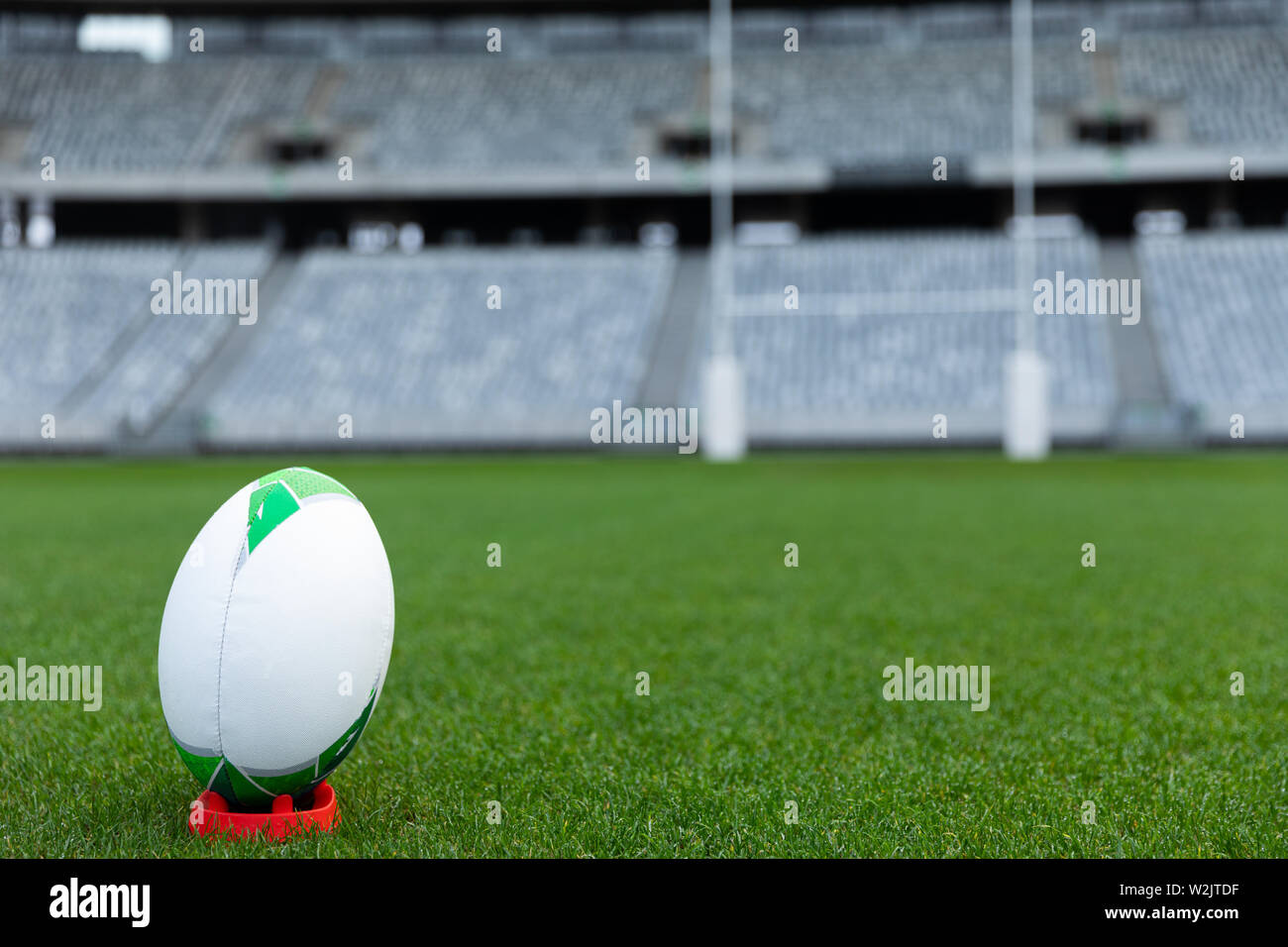 Rugby ball on a stand in stadium Stock Photo - Alamy