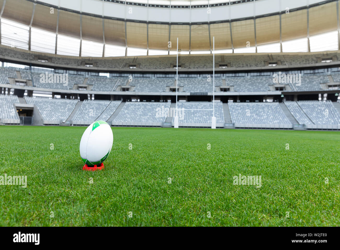 Rugby ball on a stand in a stadium Stock Photo - Alamy