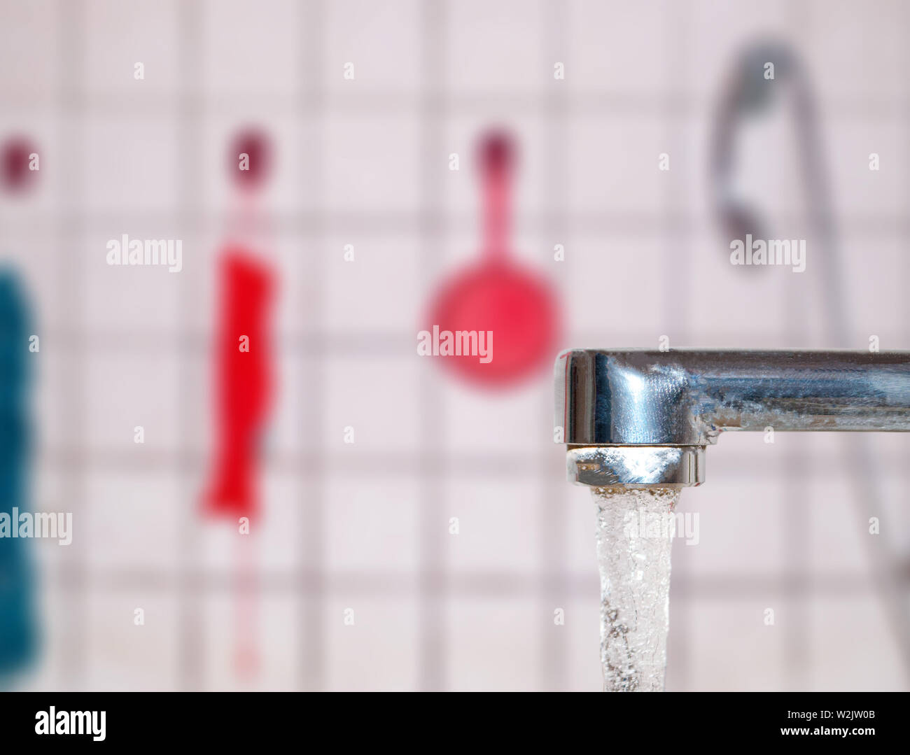 open tap with running water isolated against the background of the ...
