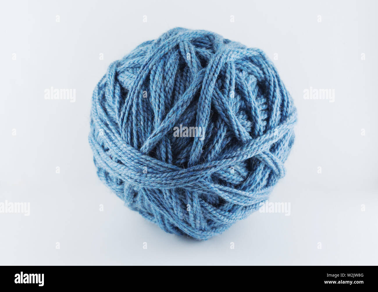 A large ball of blue wool. Cozy accessories. Materials for knitting ...