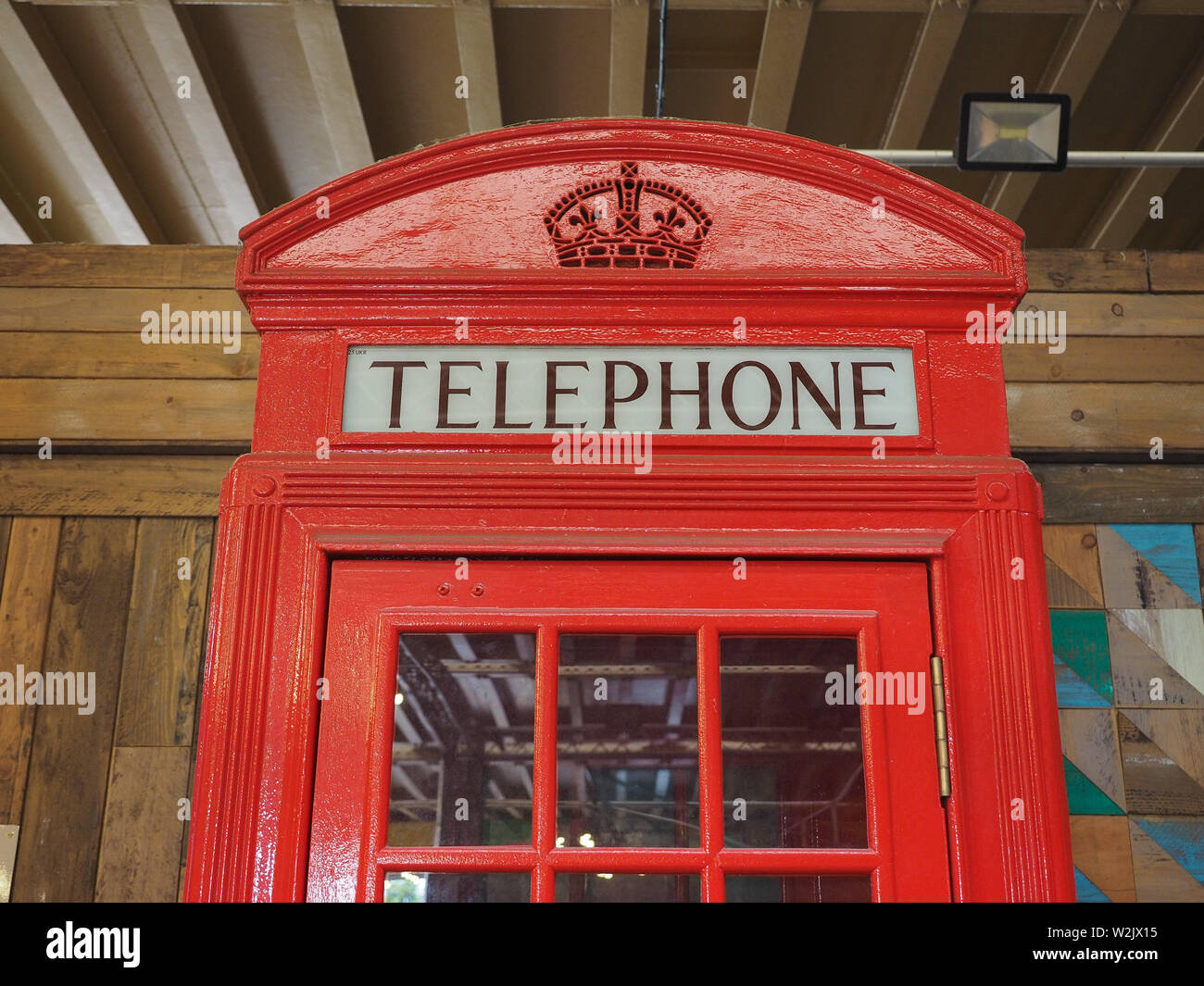 LONDON, UK - CIRCA JUNE 2019: Traditional red telephone box designed by Sir Giles Gilbert Scott ...