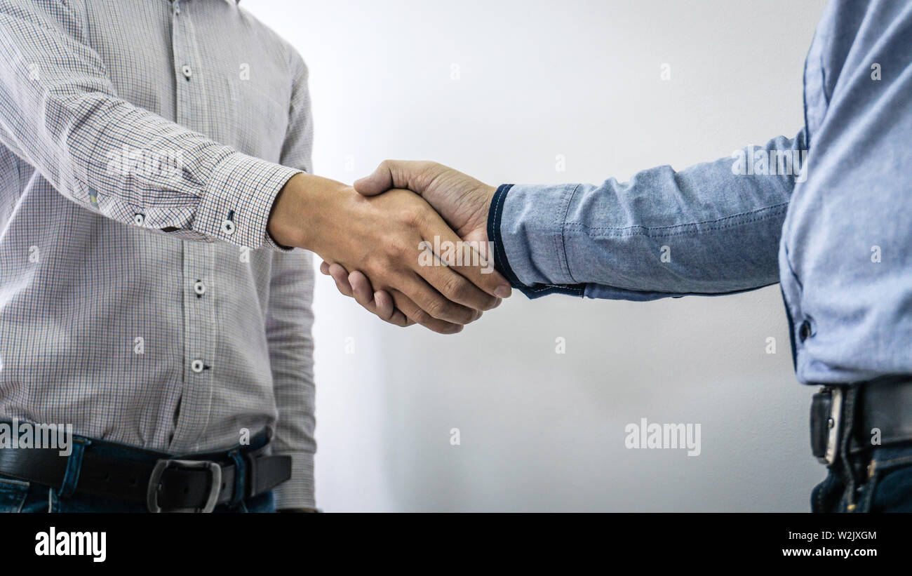 Finishing up a meeting, handshake of two happy business people after ...