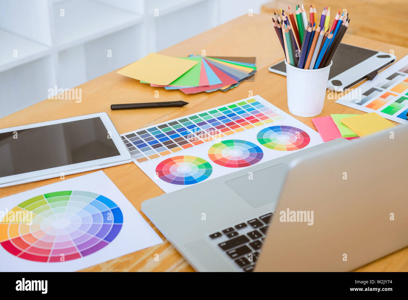 Graphic designer object tool and color swatch samples at workspace ...