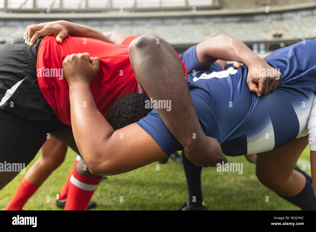 Male rugby players playing rugby match in stadium Stock Photo - Alamy