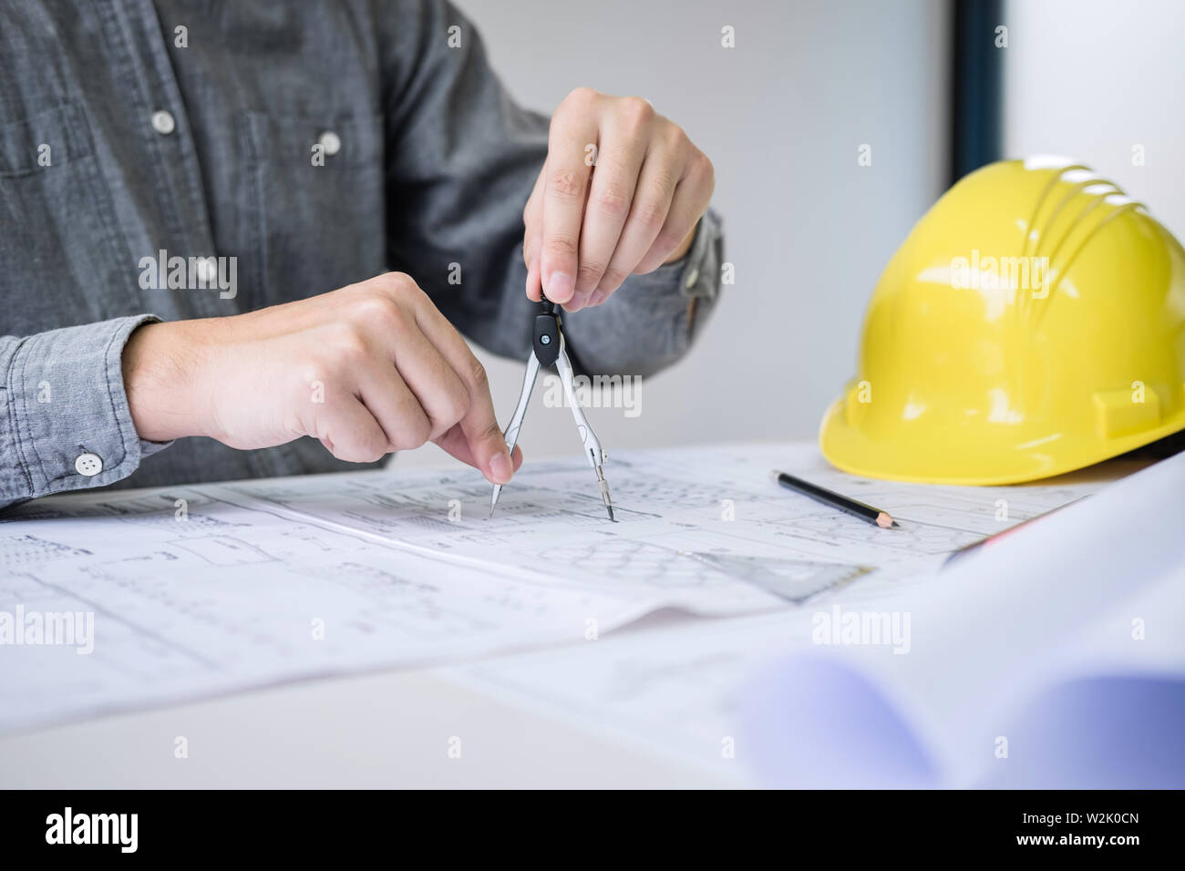 Construction engineering or architect hands working on blueprint ...