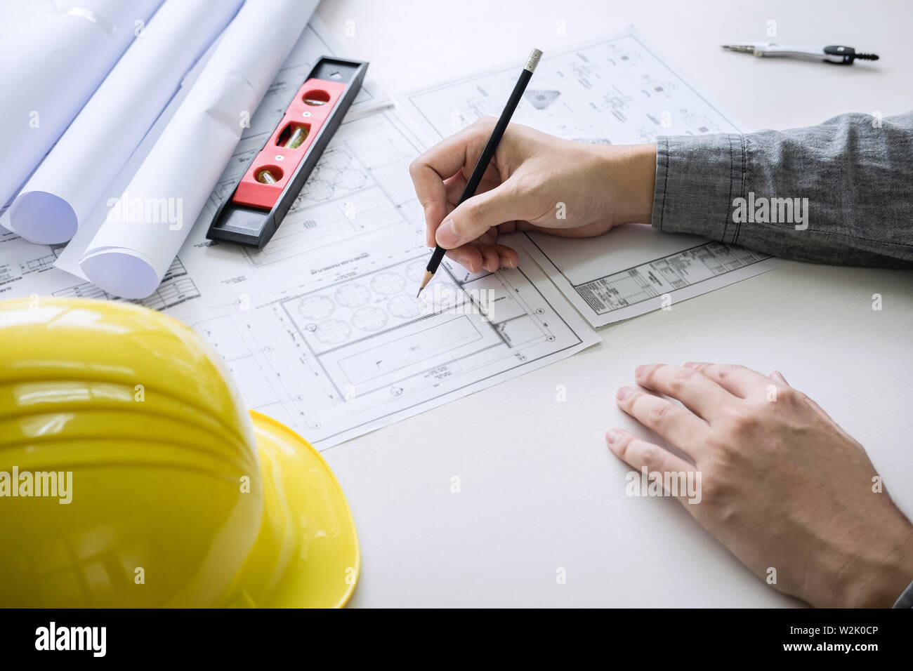 Construction engineering or architect hands working on blueprint ...