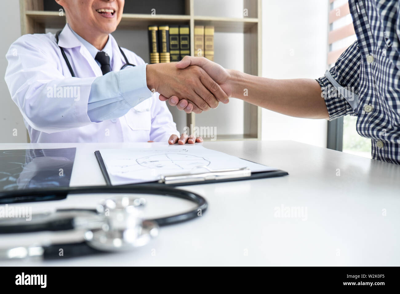 Professor Doctor having shaking hands with patient after recommend ...