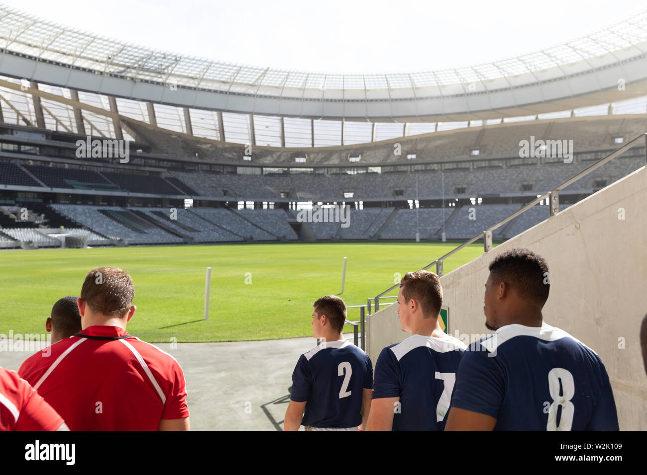 Male rugby players standing in a row at stadium for match Stock Photo ...