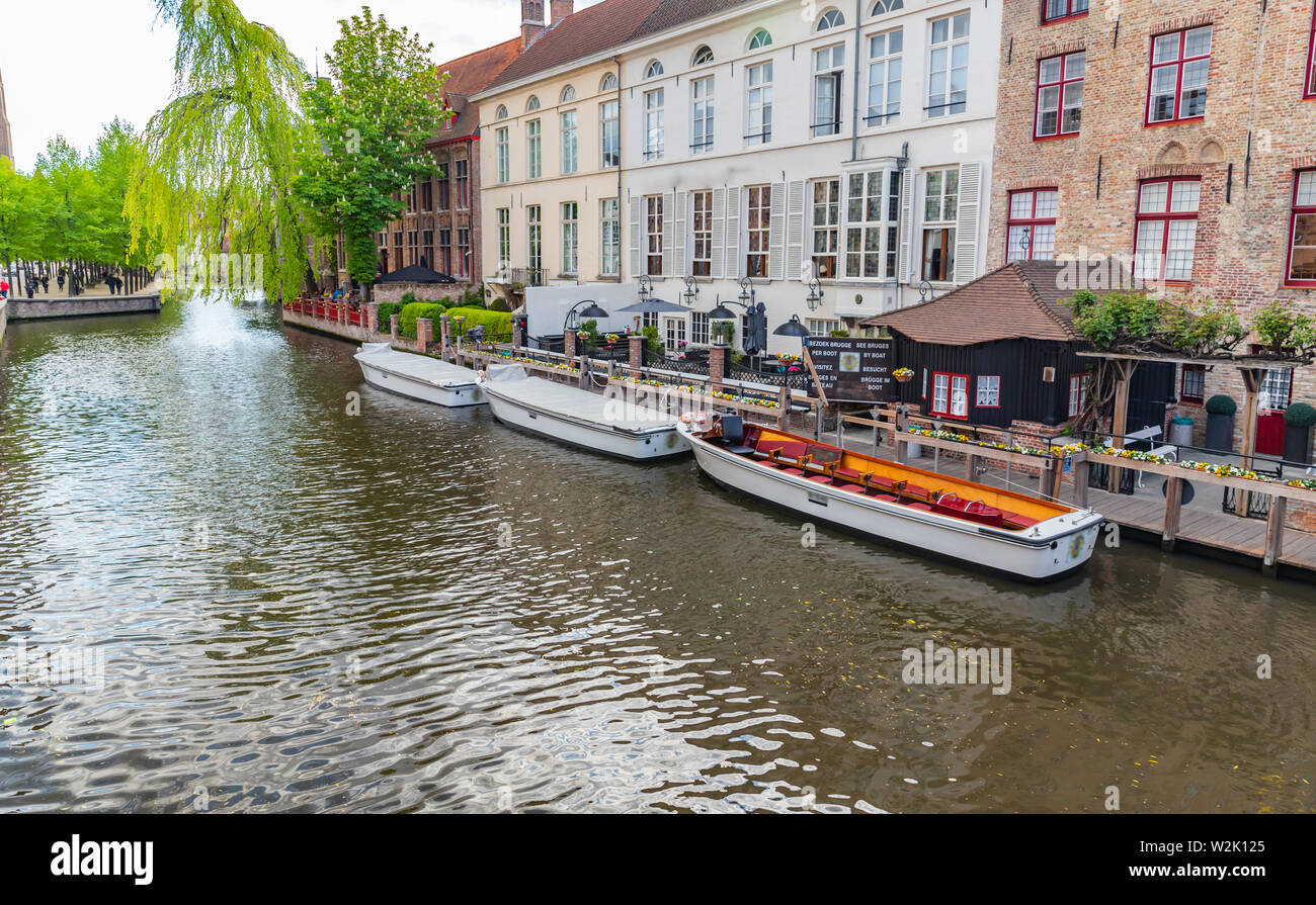 View of Dijver canal with houses and trees in Bruges, Belgium Stock ...