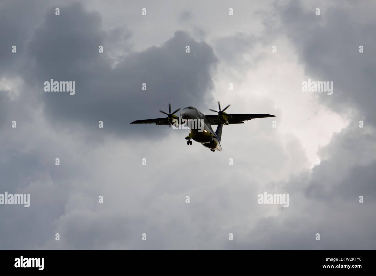 Propeller aircraft (turboprop) in a violent storm Stock Photo - Alamy