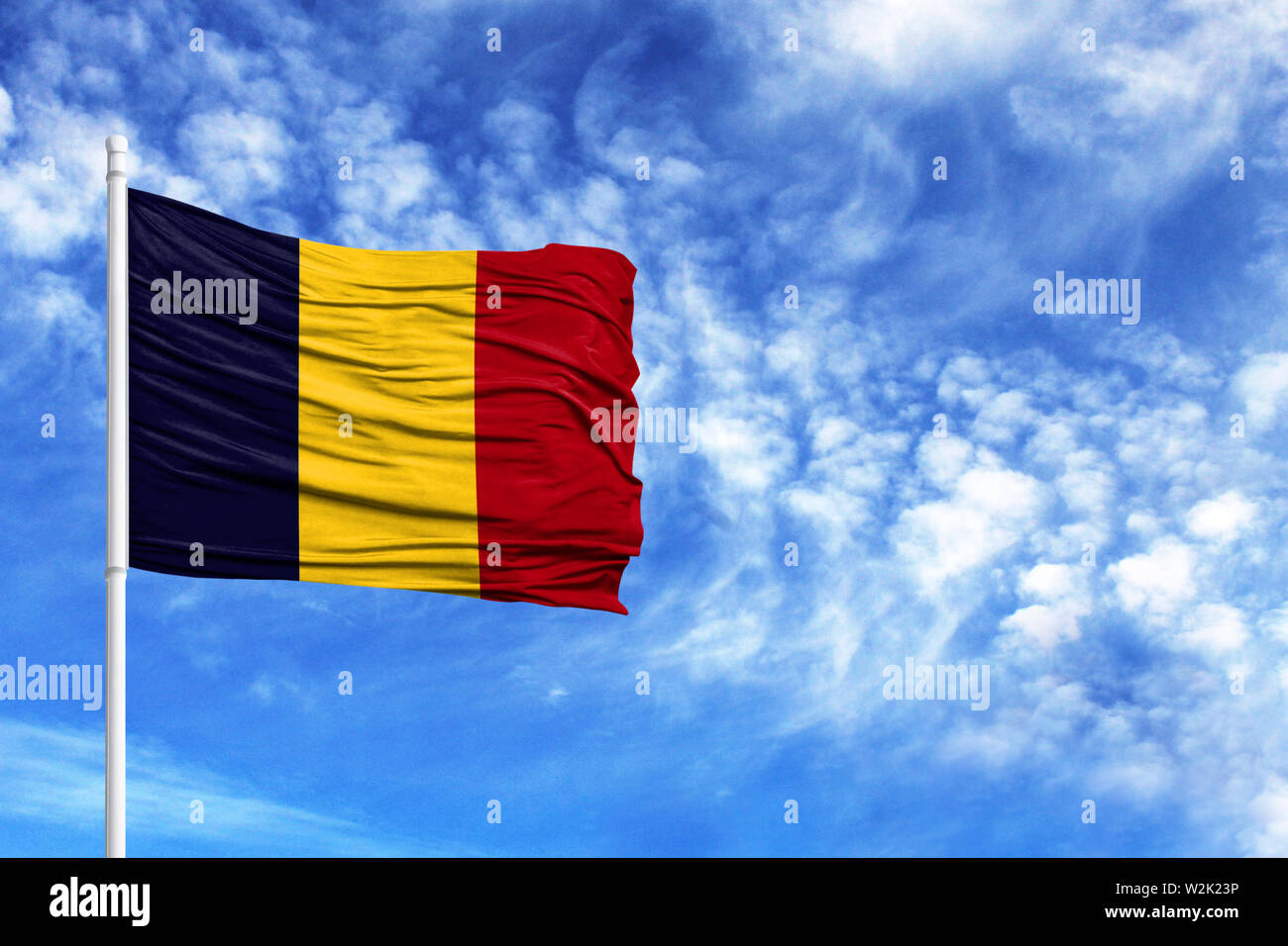 National flag of Chad on a flagpole in front of blue sky Stock Photo ...