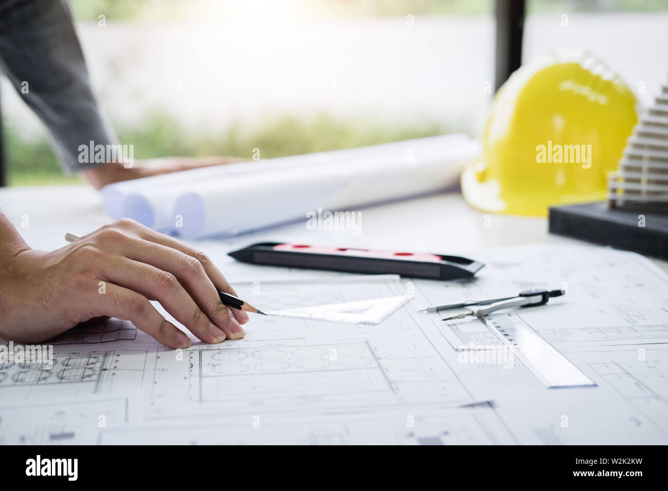 Construction engineering or architect hands working on blueprint ...