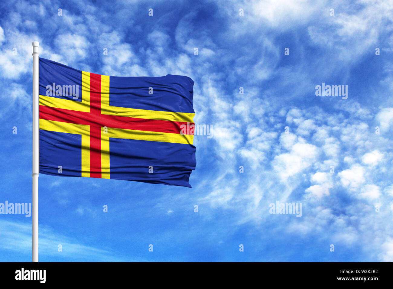 National flag of Aland on a flagpole in front of blue sky Stock Photo - Alamy