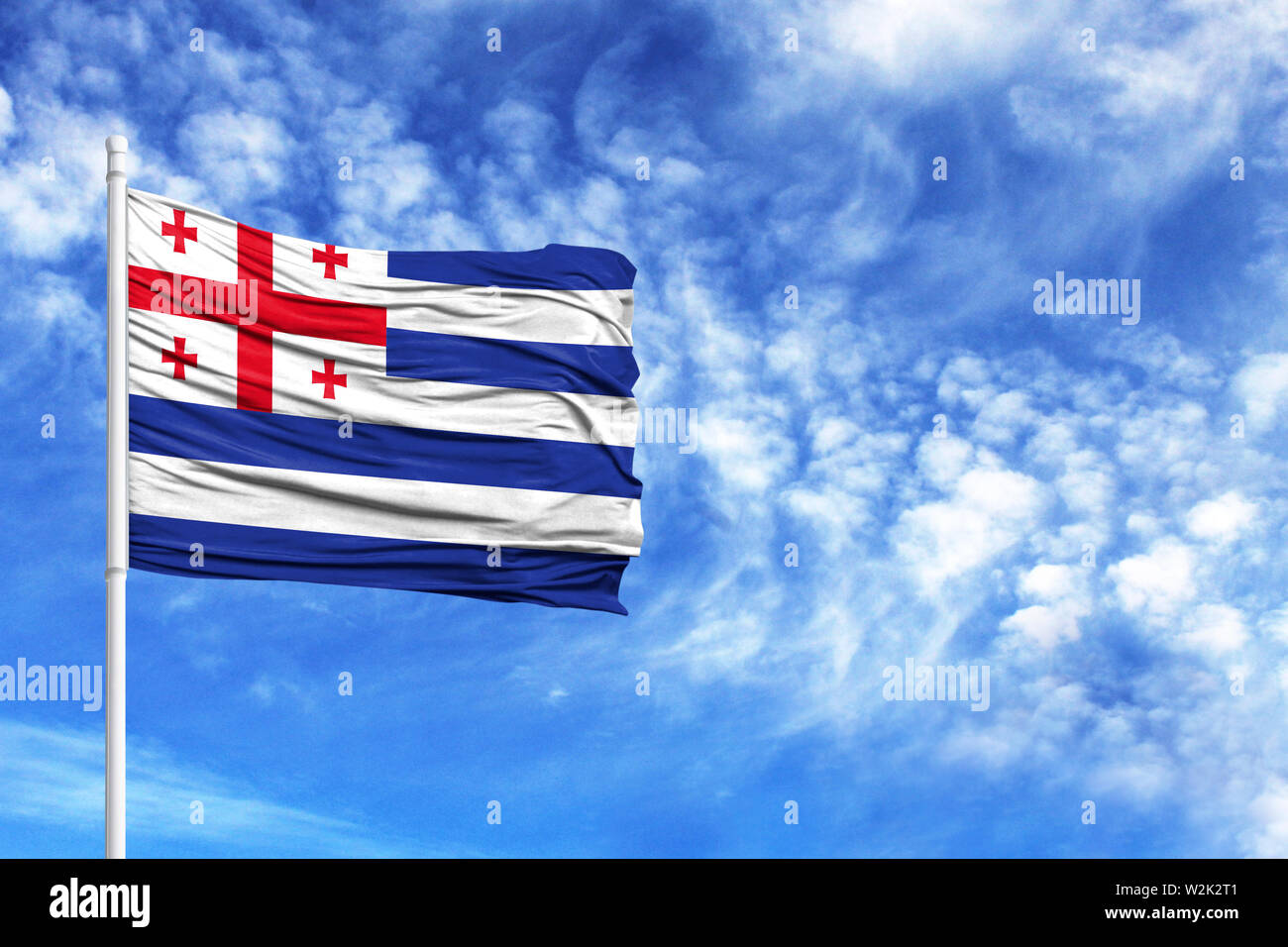 National flag of Adjara on a flagpole in front of blue sky Stock Photo ...