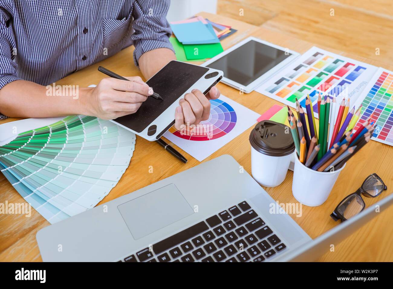 Young creative graphic designer working on project architectural ...