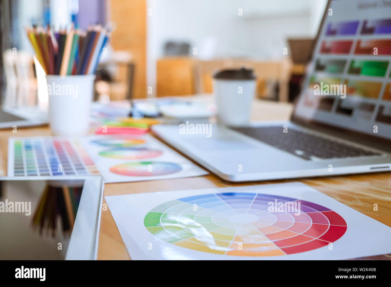 Graphic designer object tool and color swatch samples at workspace ...