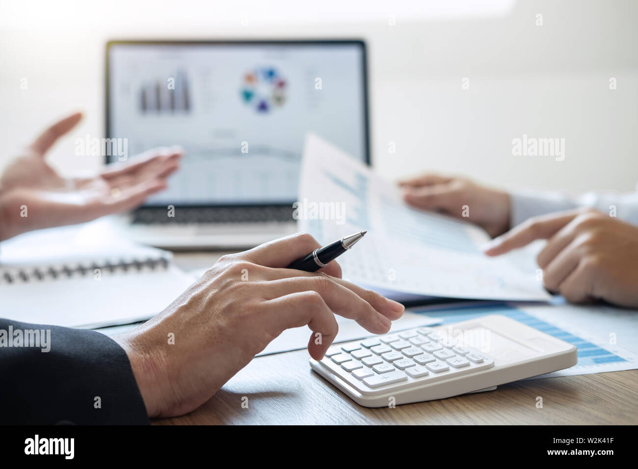 Professional Business colleague team working and analyzing with new ...