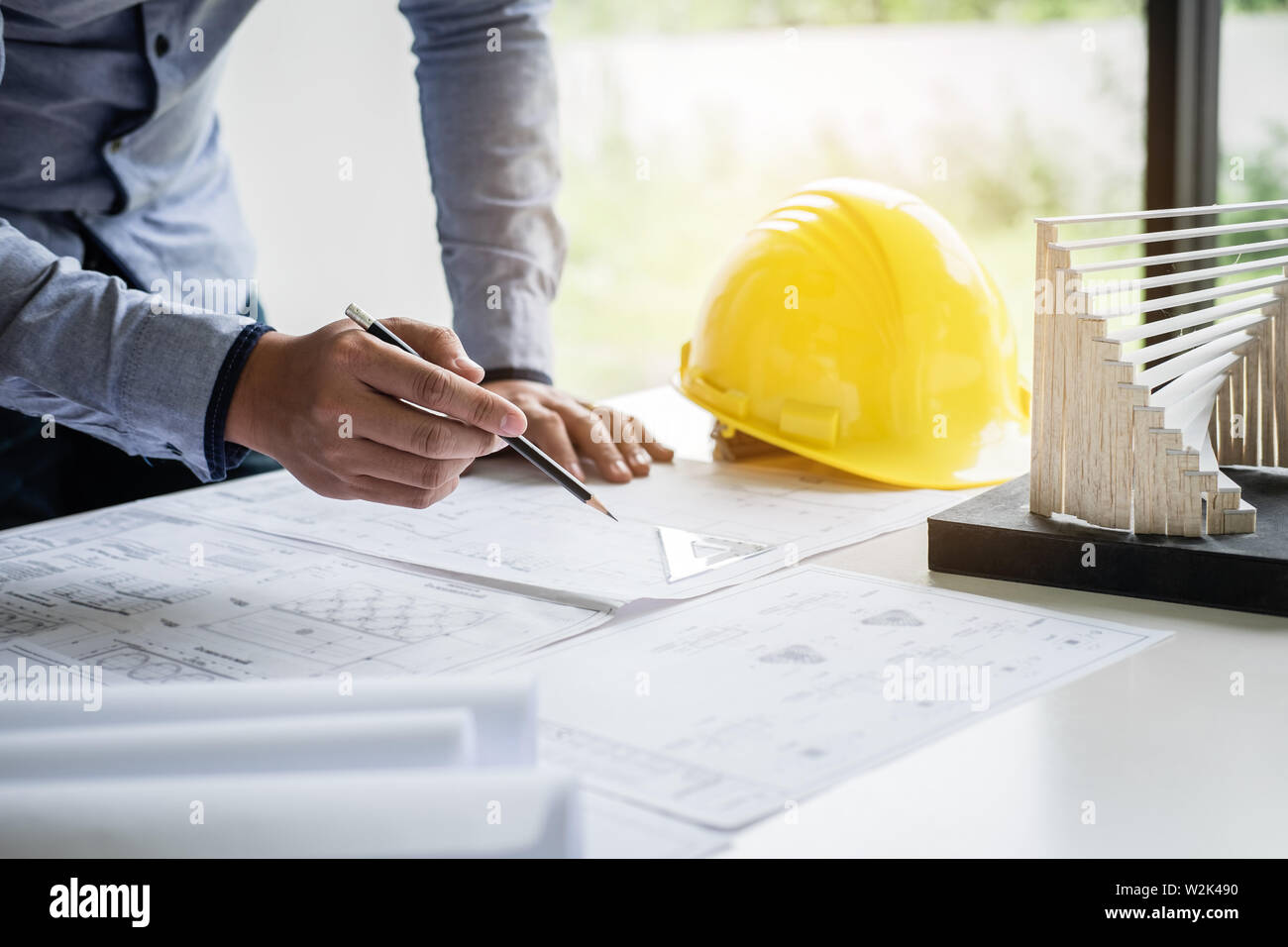 Construction engineering or architect hands working on blueprint ...