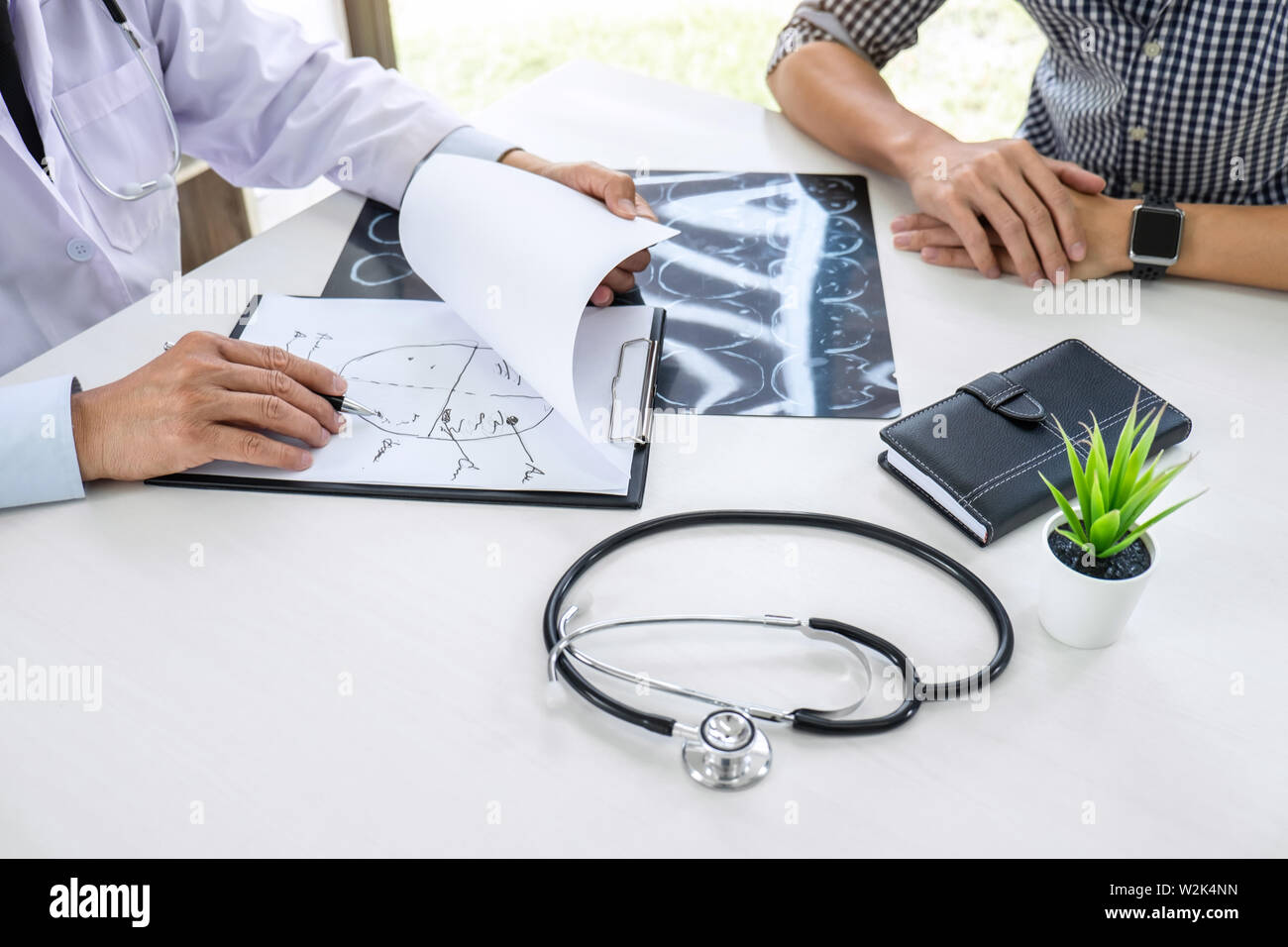Professor Doctor having conversation with patient and holding x-ray ...