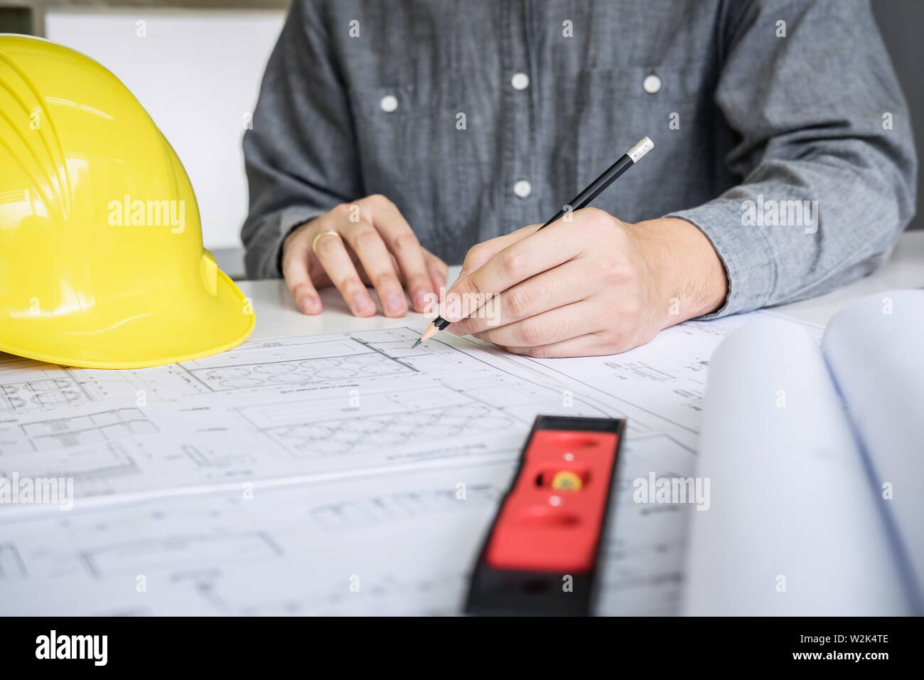 Construction engineering or architect hands working on blueprint ...
