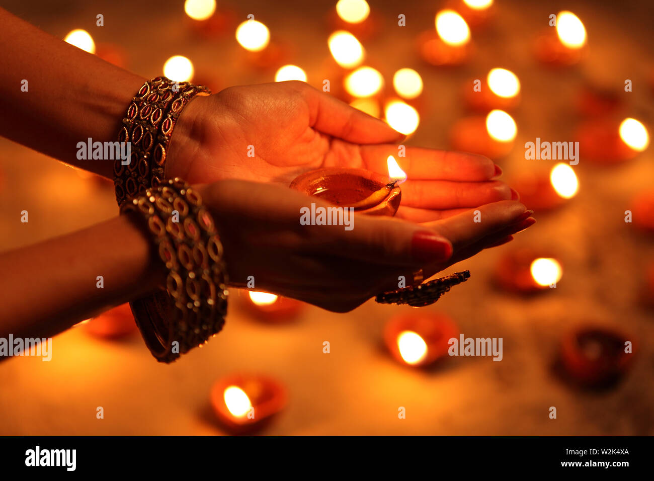Lady Holding Diya High Resolution Stock Photography and Images - Alamy