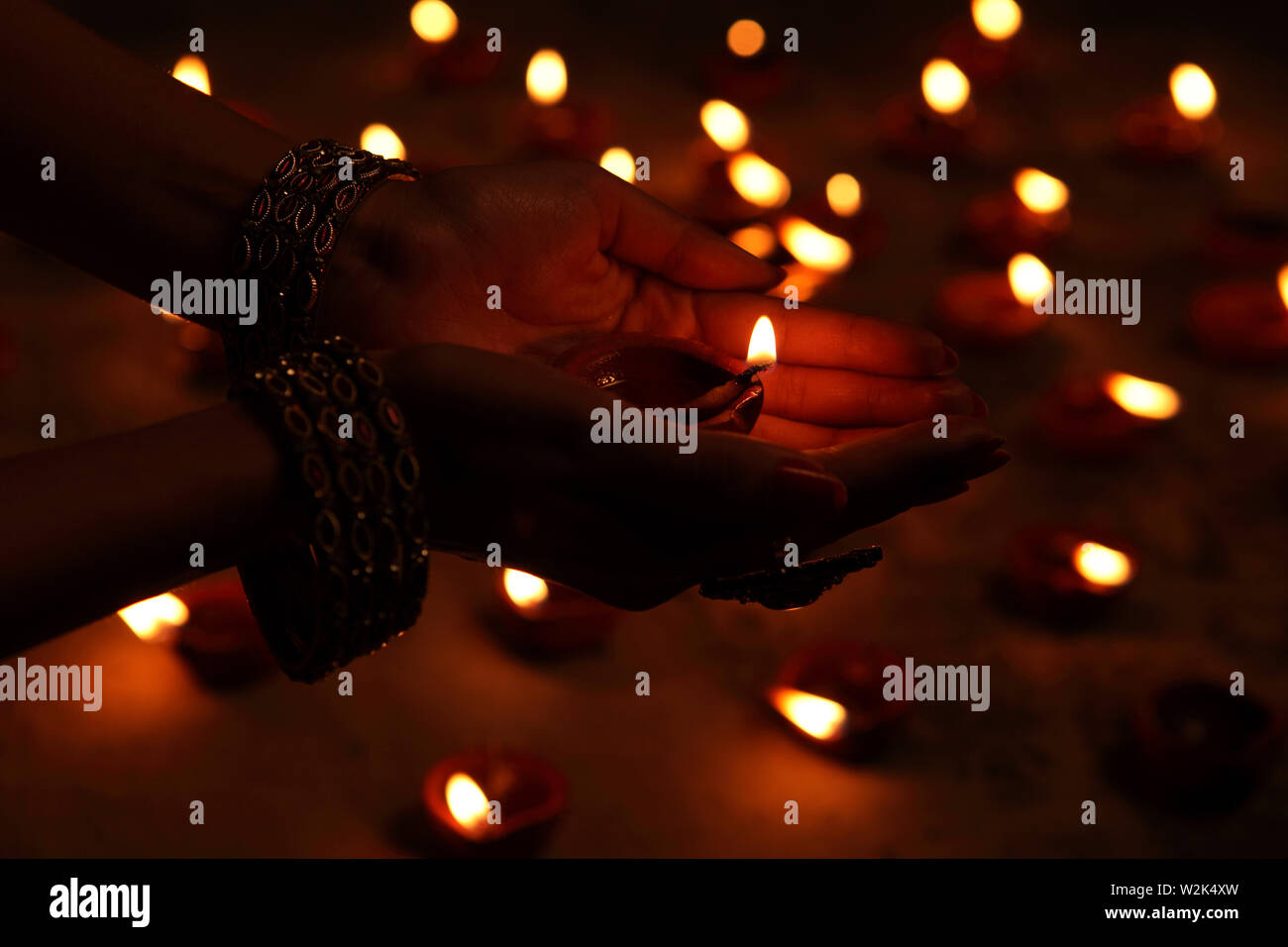 Indian female with diya hi-res stock photography and images - Alamy