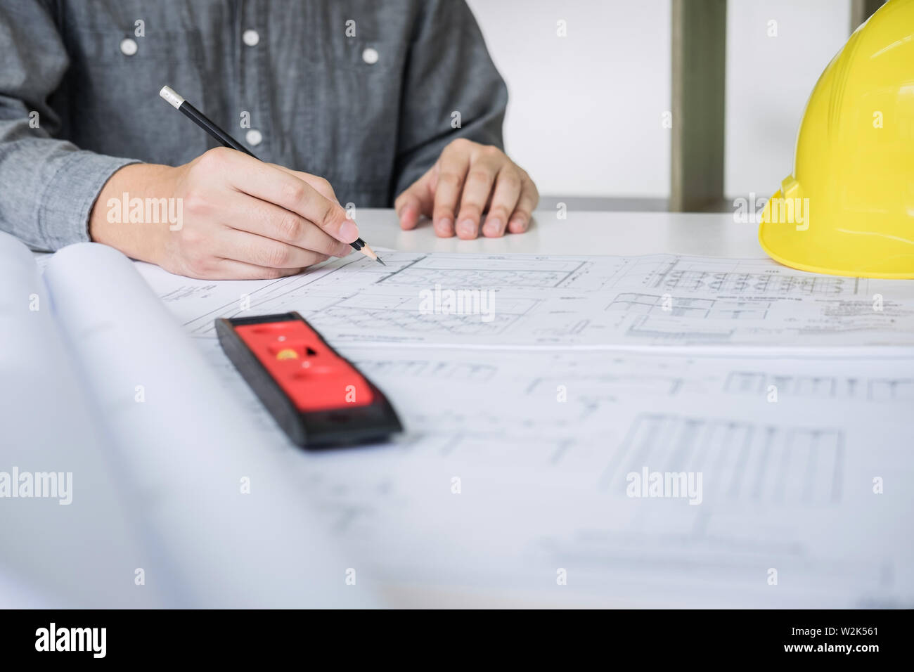 Construction engineering or architect hands working on blueprint ...