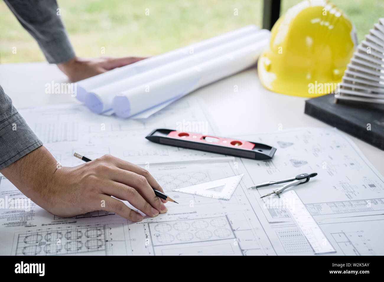 Construction engineering or architect hands working on blueprint ...