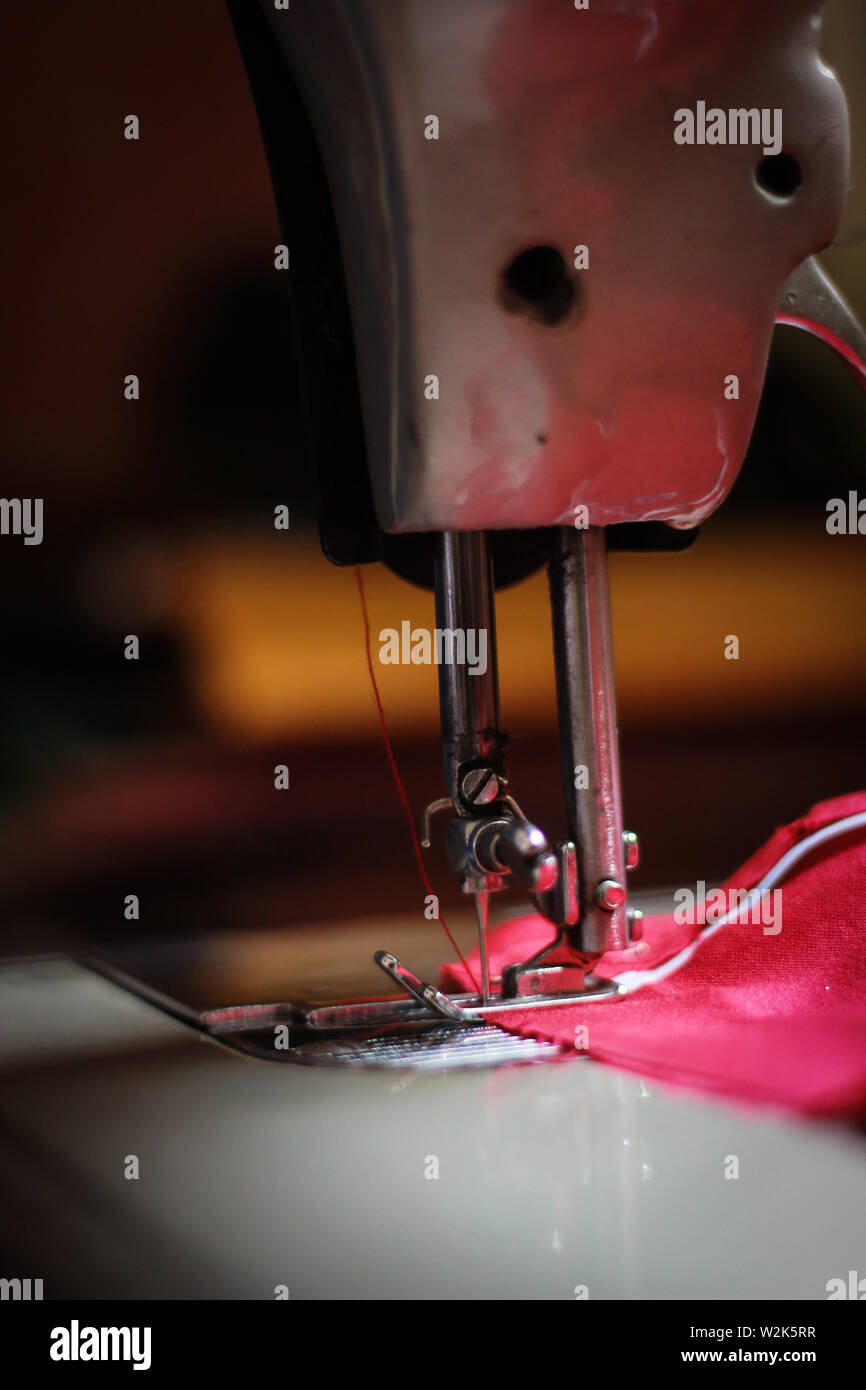 sewing machine with red thread and needle Stock Photo - Alamy