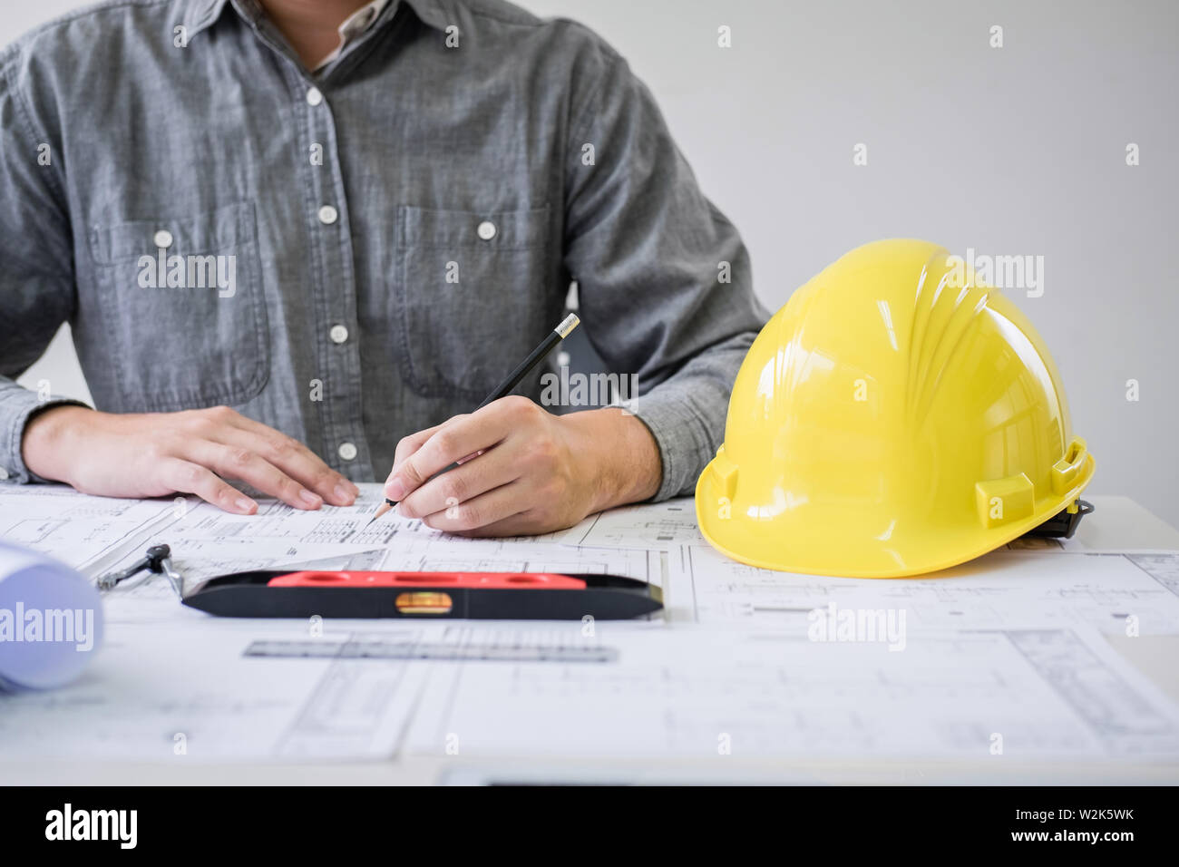 Construction engineering or architect hands working on blueprint ...