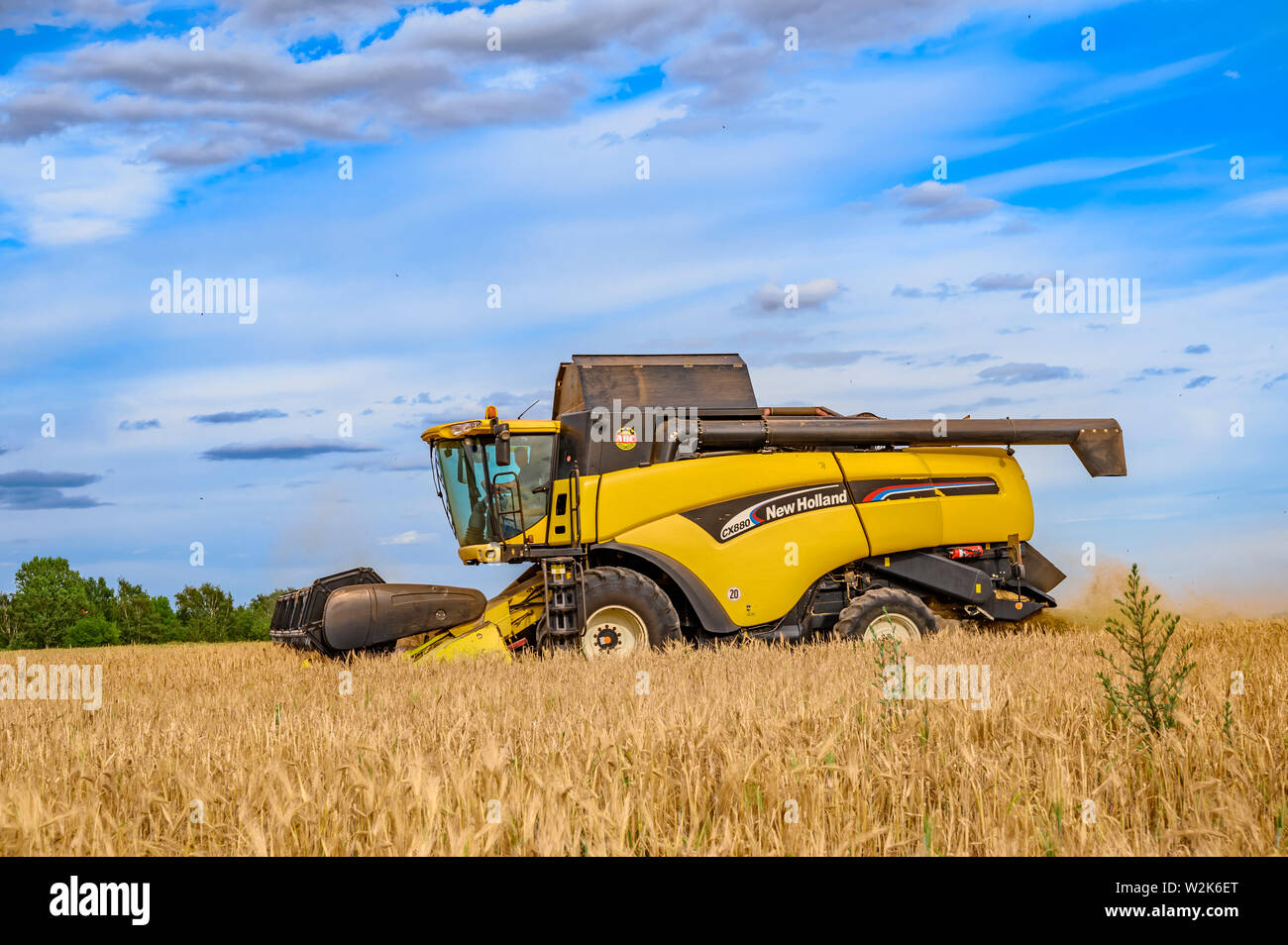 Berlin, Germany - July 05, 2019: Side view of a moving combine ...