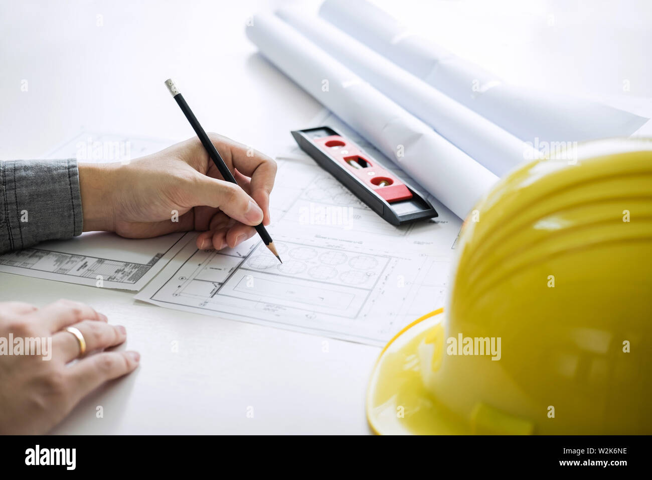 Construction engineering or architect hands working on blueprint ...