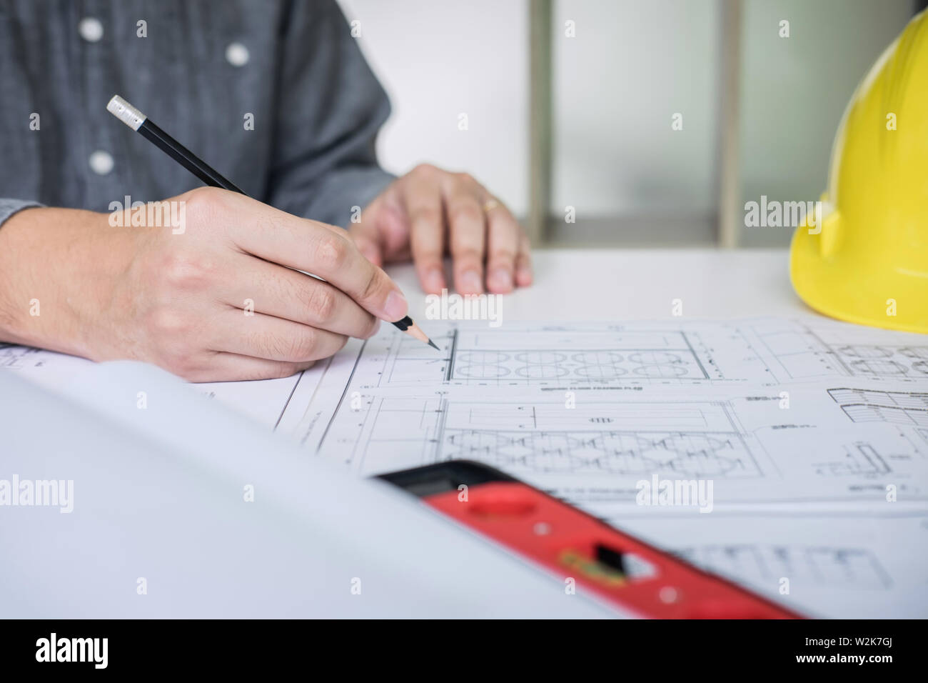 Construction engineering or architect hands working on blueprint ...