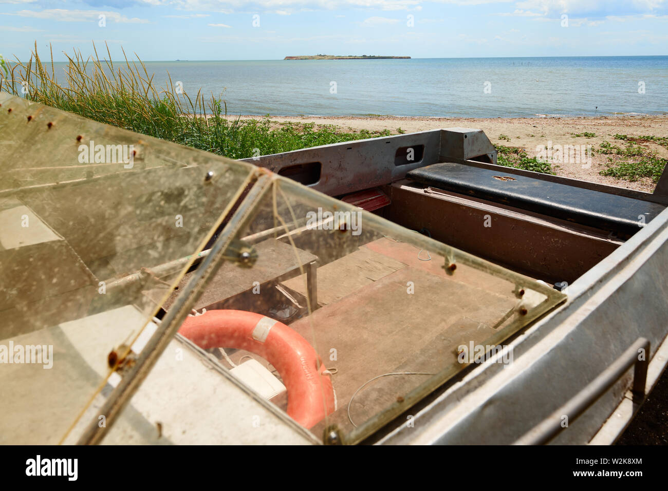 wild sea coast and old boat - beautiful summer landscape Stock Photo ...