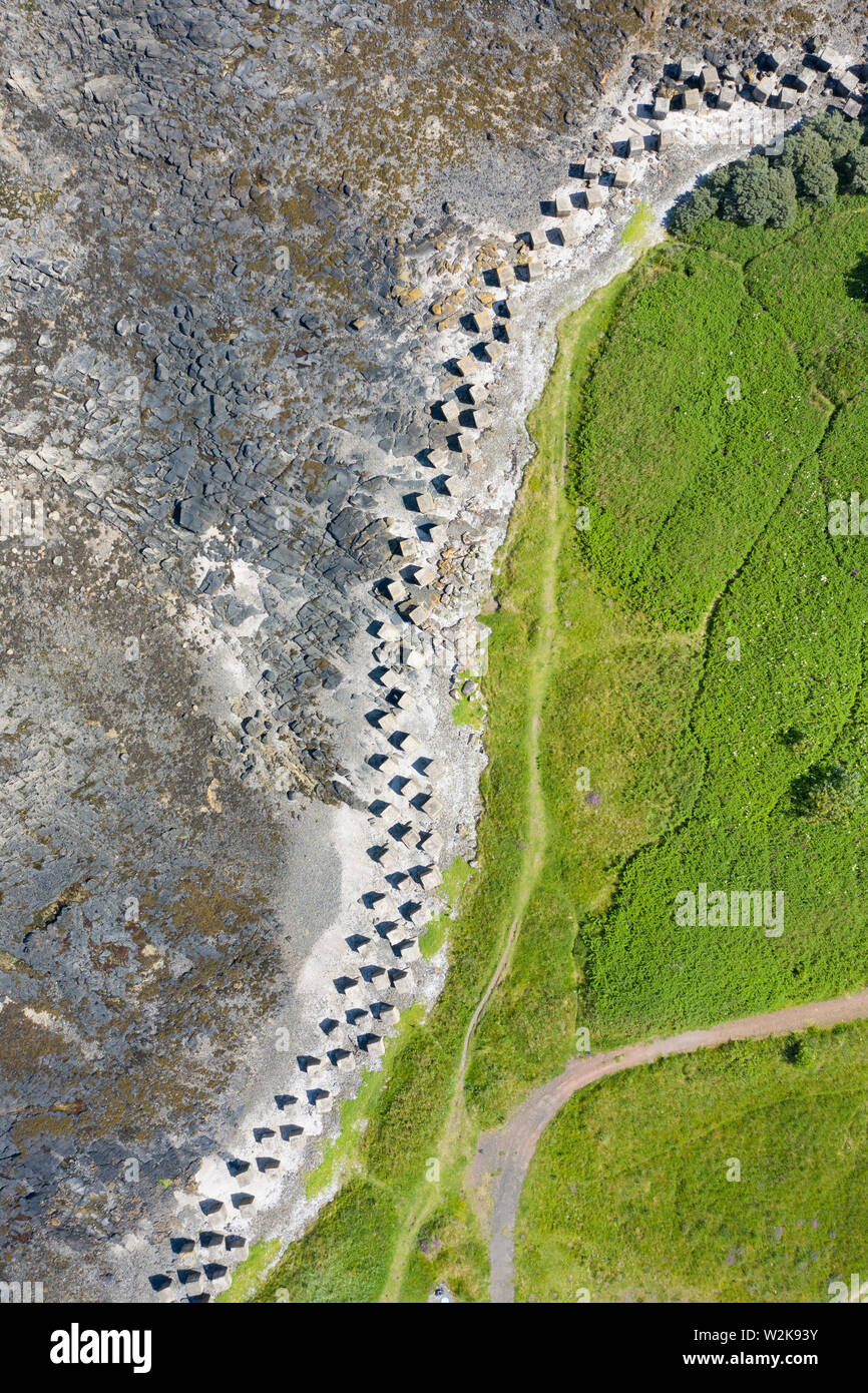 Aerial view of Second World War era anti-tank blocks on shore at ...
