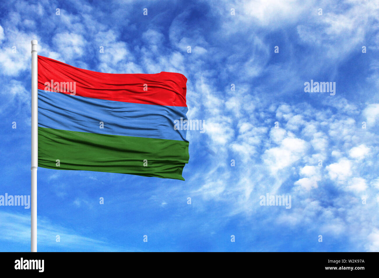 National flag of Karelia on a flagpole in front of blue sky Stock Photo ...