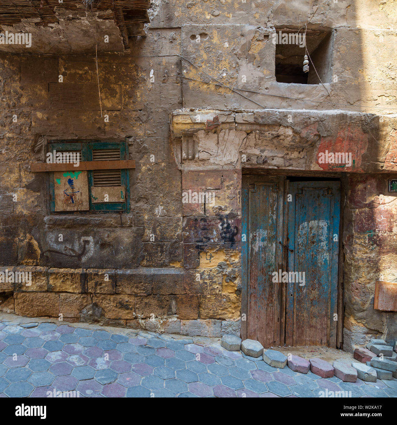 Grunge stone bricks wall with Broken wooden door and closed broken ...