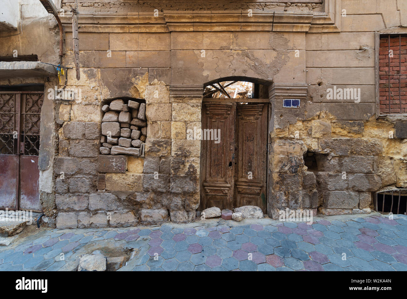 Grunge stone bricks wall with Broken wooden door and closed broken ...