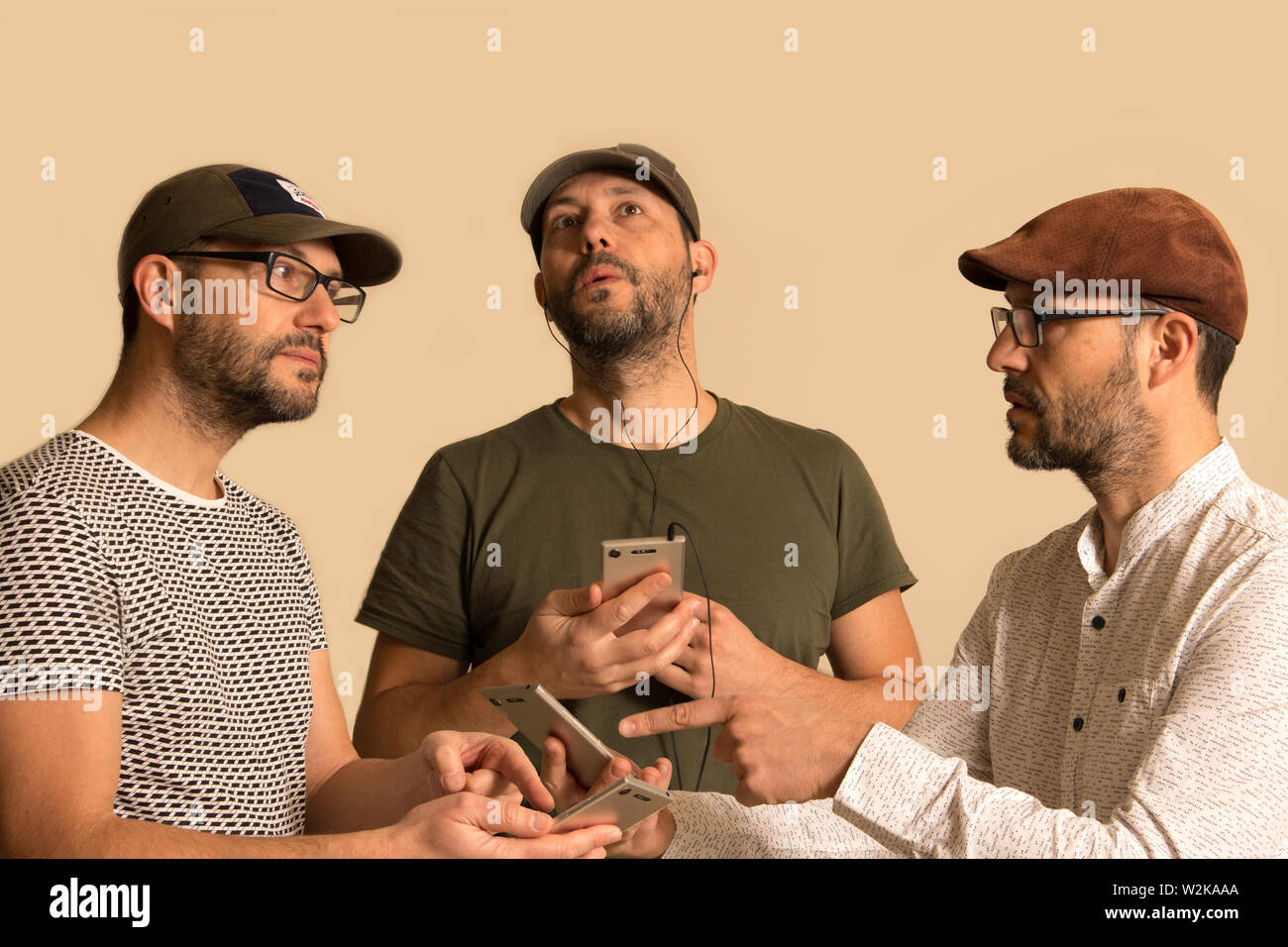 Triple self portrait, handling mobile phone technology, communication ...