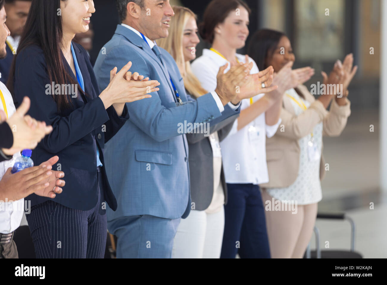Diverse executives clapping at meeting in conference room Stock Photo ...