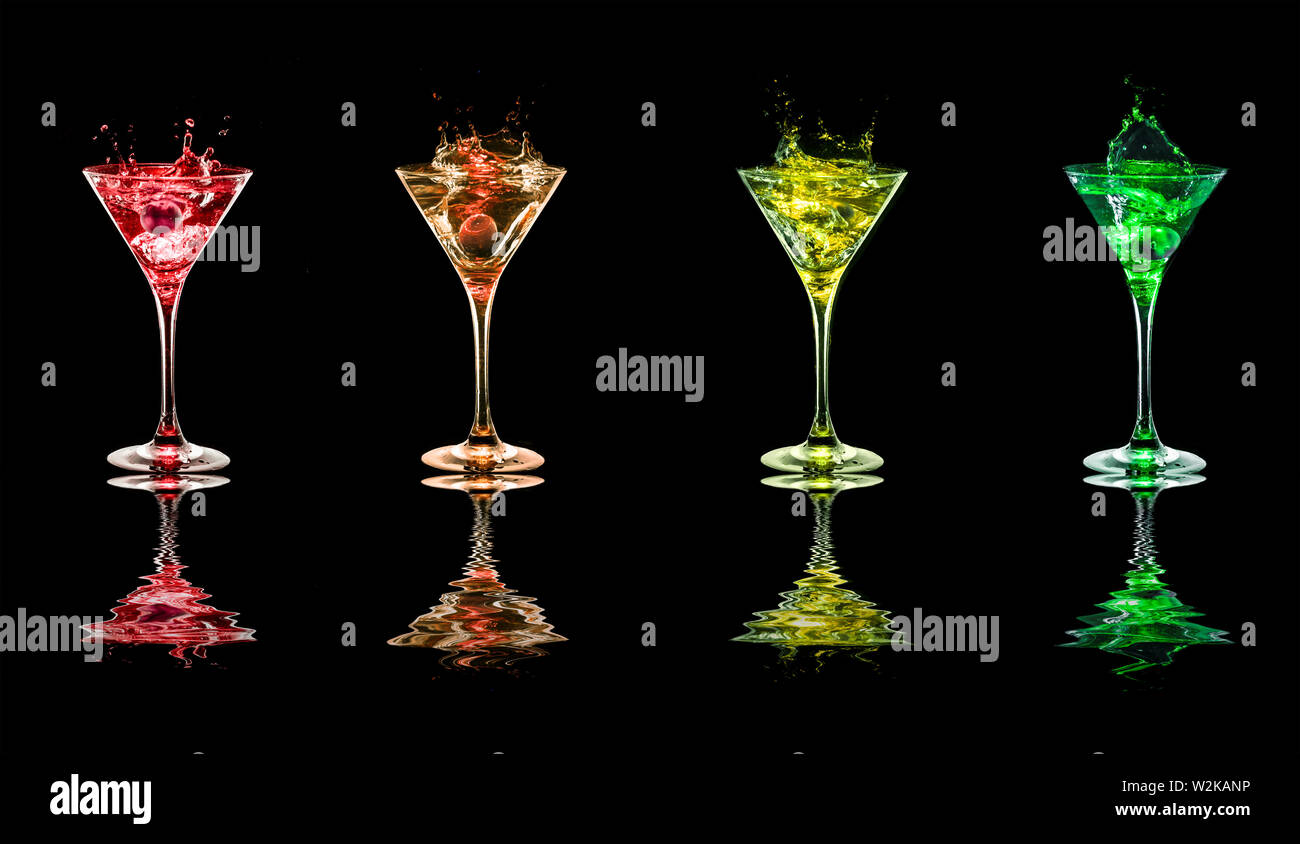 Multicolored Bright cocktails in glasses on black background with ...