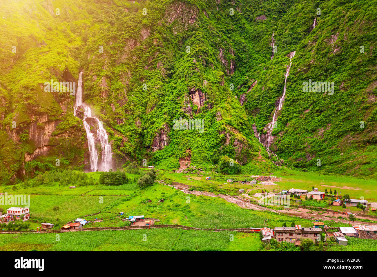 Beautiful mountains landscape with waterfalls and buildings in Nepal ...