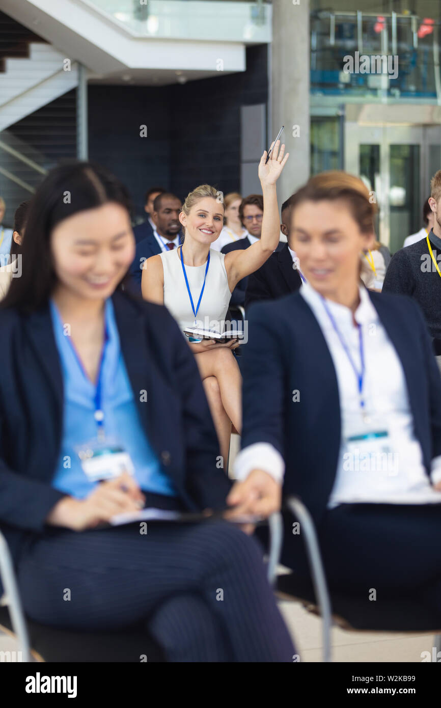 Businesswoman asking question in speech in conference room Stock Photo ...