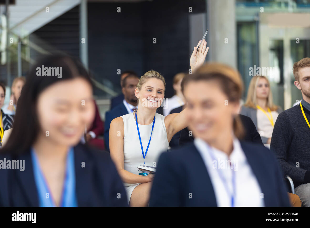 Businesswoman asking question in speech in conference room Stock Photo ...