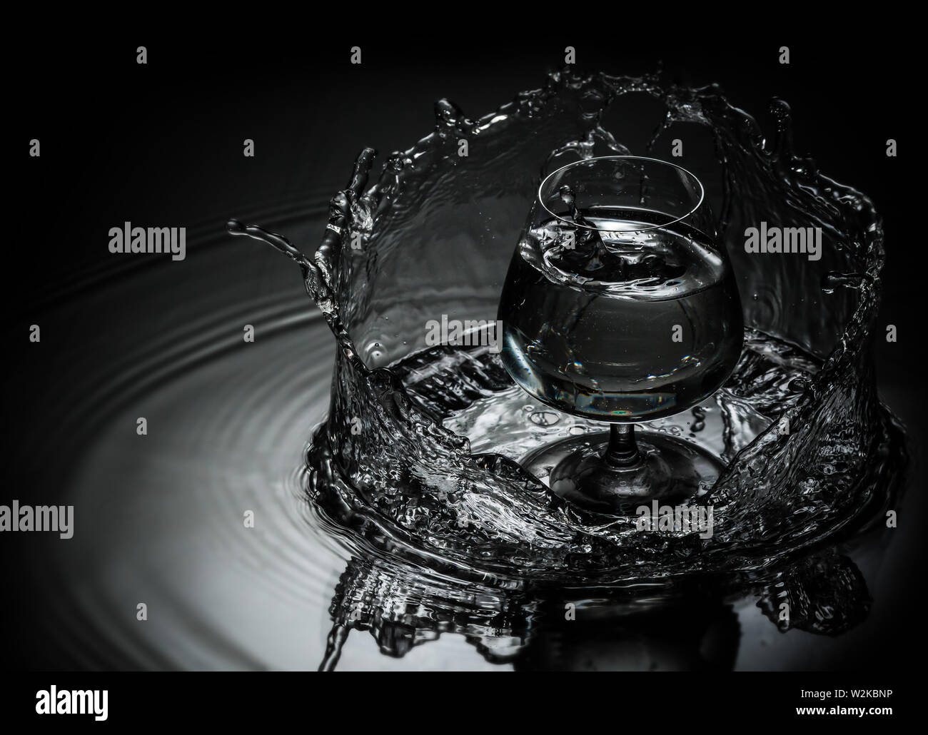 closeup of water drops falling in the glass Stock Photo - Alamy