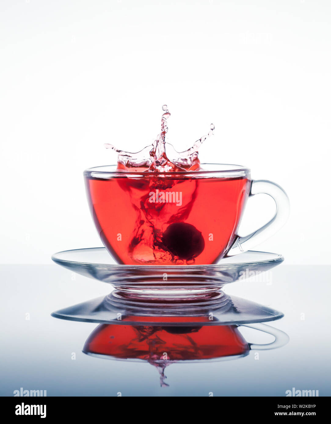 cup of tea with splashes on the mirror surface Stock Photo - Alamy