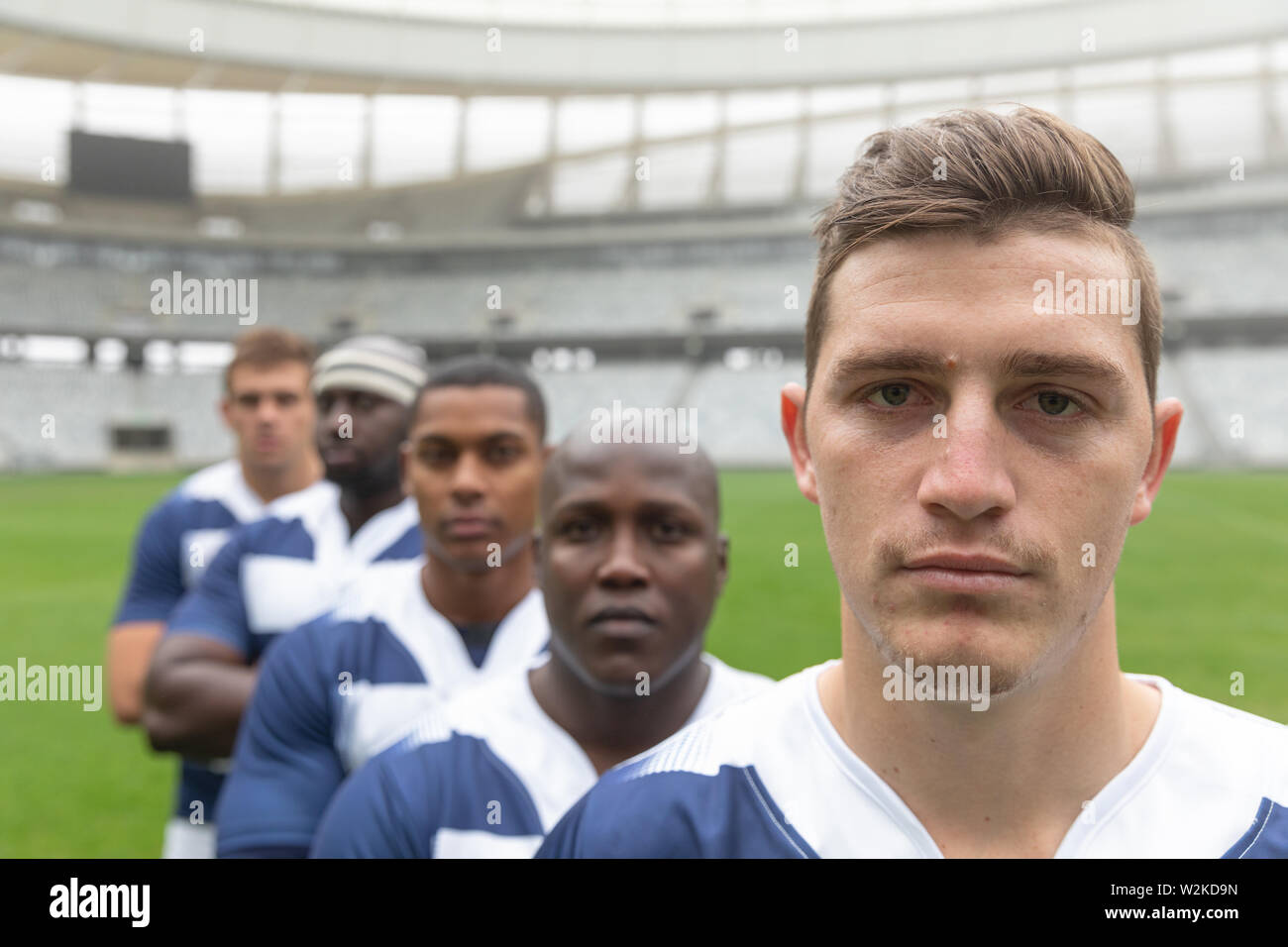 Group of diverse male rugby players standing together in stadium Stock ...