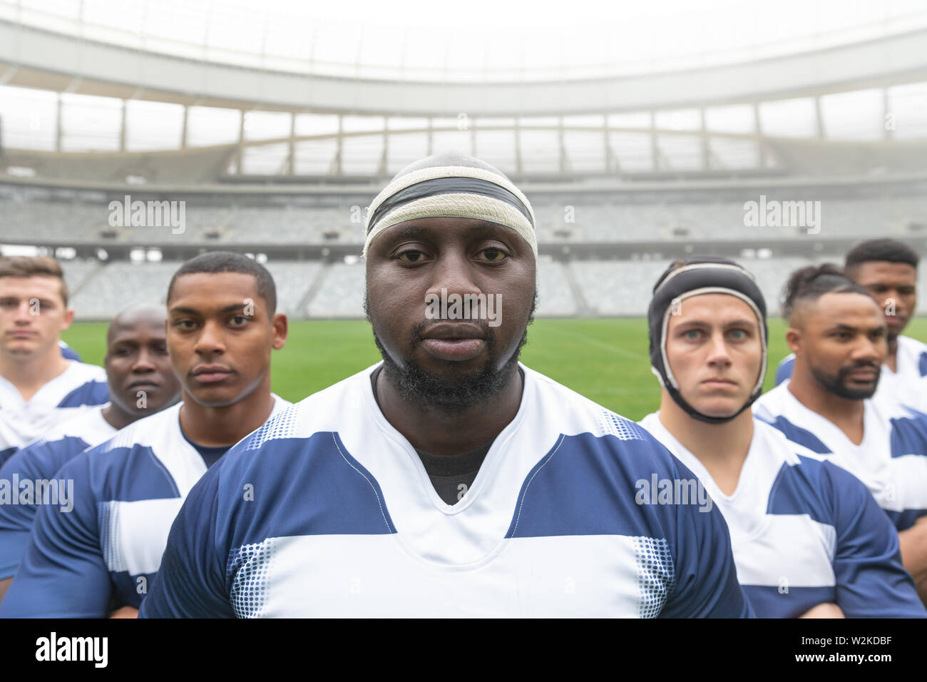 Group of diverse male rugby players standing together in stadium Stock ...
